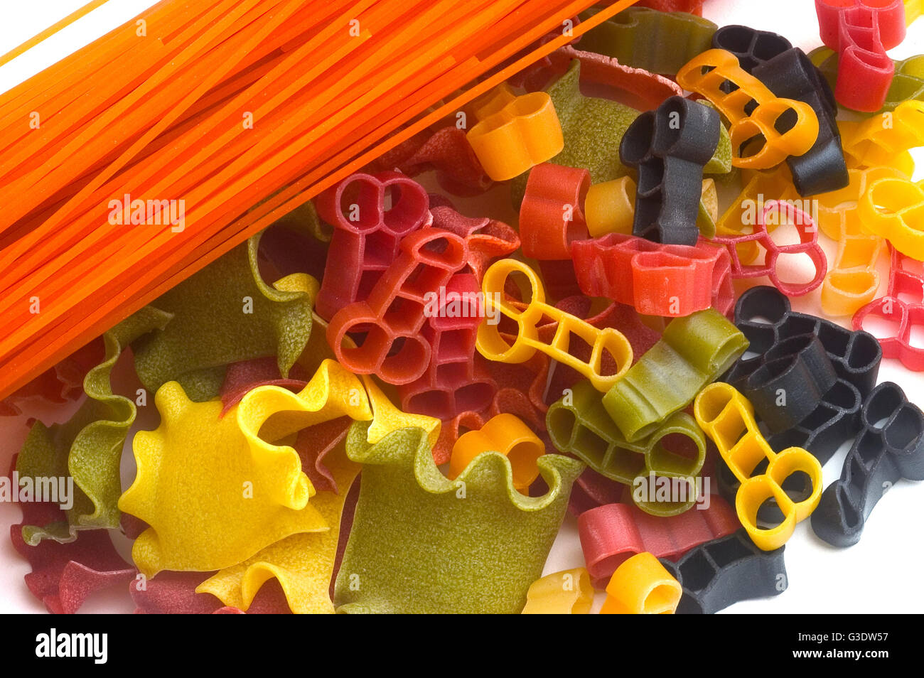 Italian colorful pasta in a funny shape photographed in studio on white ...