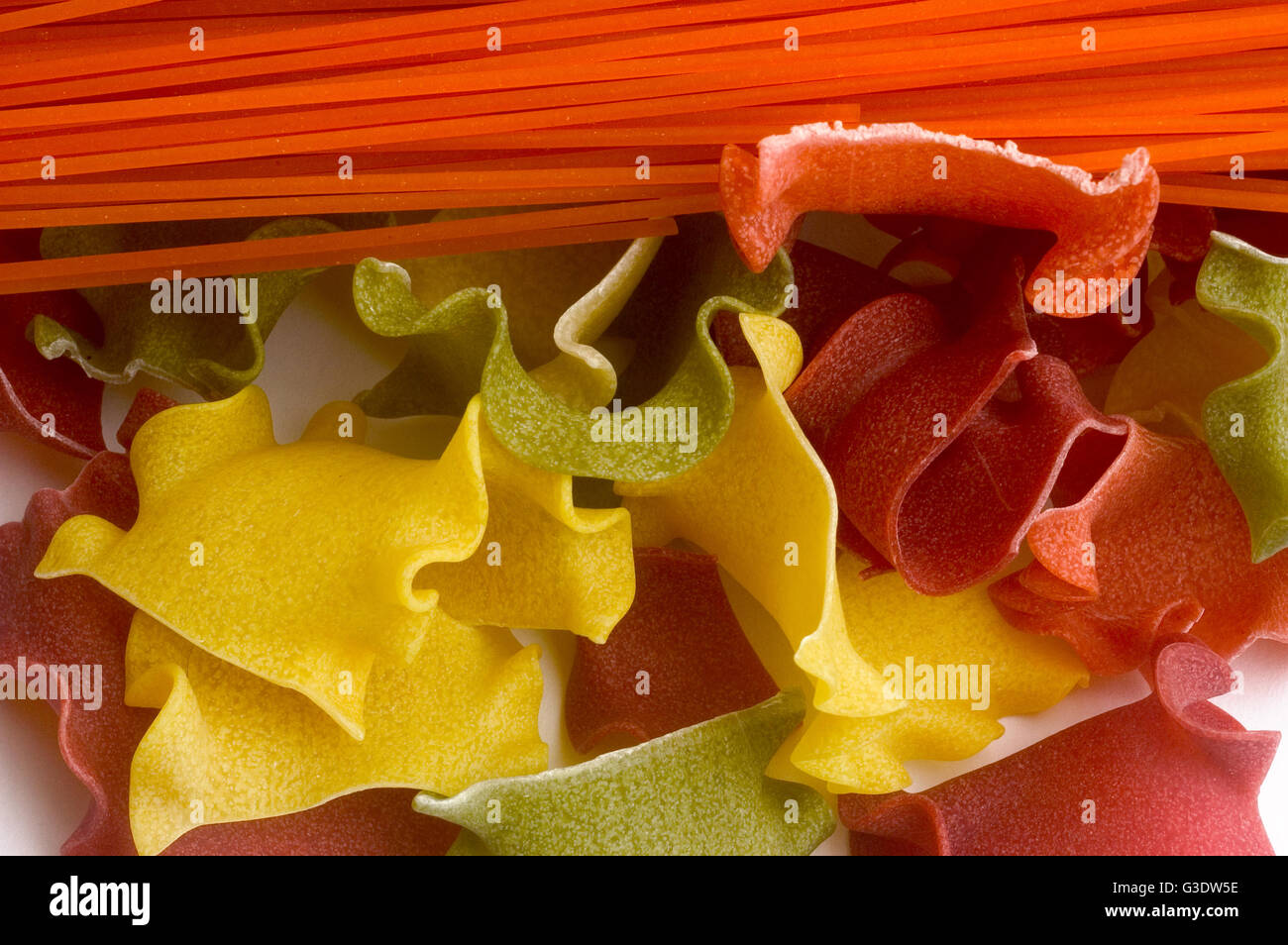 Italian colorful pasta in a funny shape photographed in studio on white ...