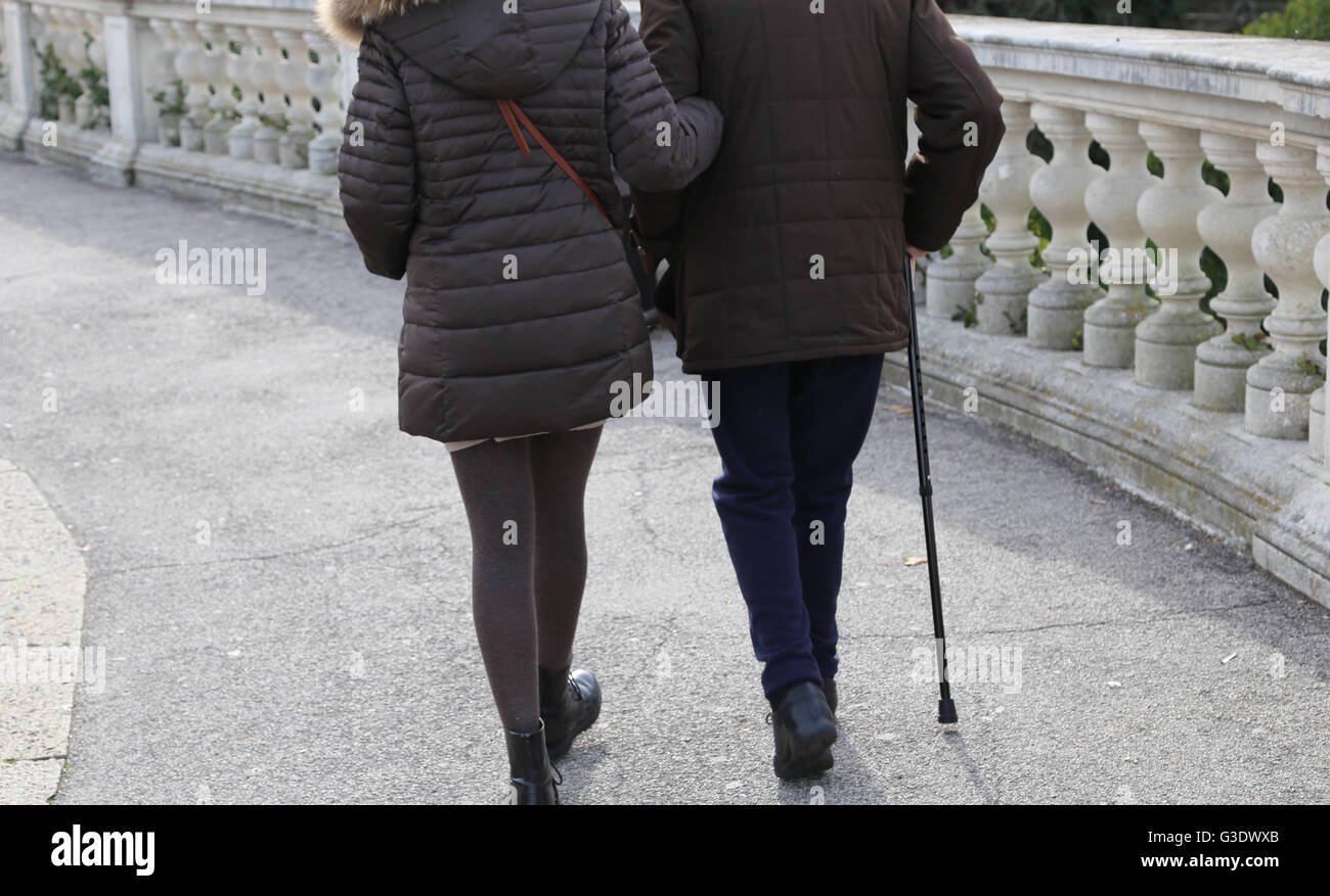 Woman helping older man hi-res stock photography and images - Alamy