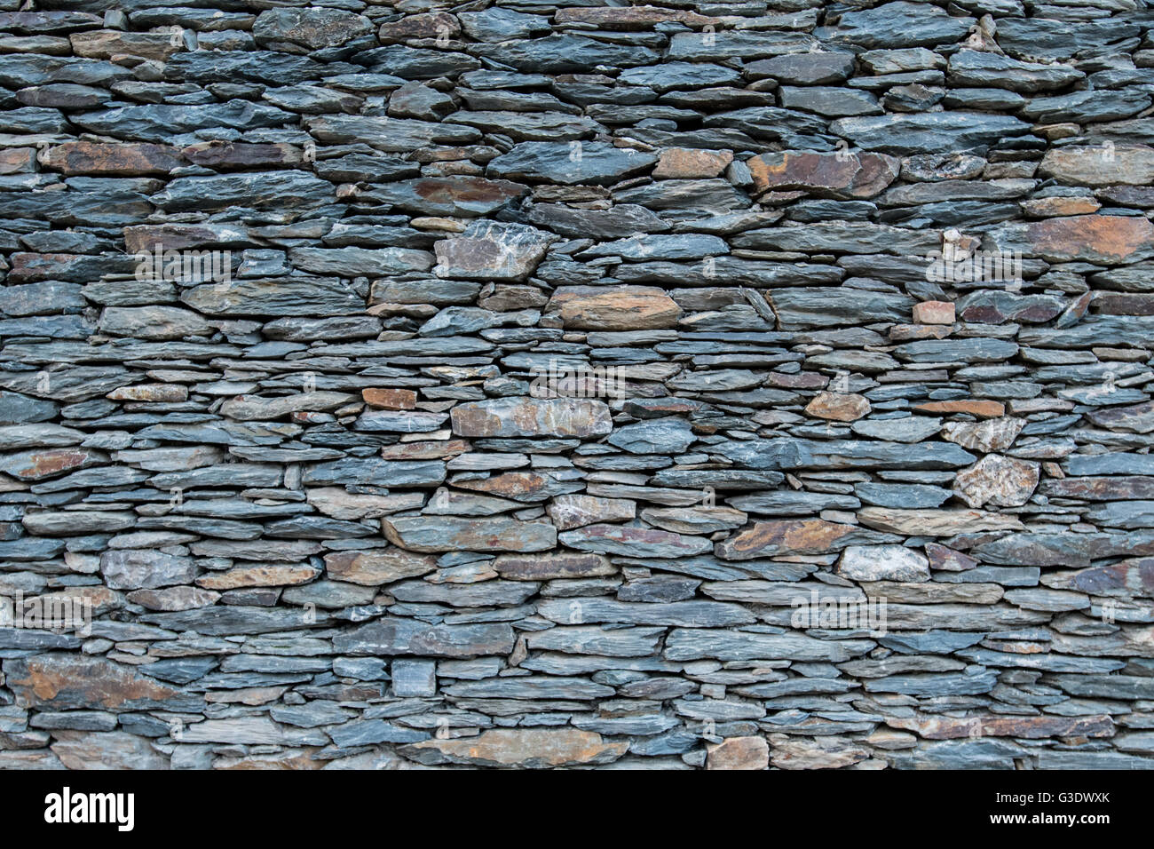 Tightly Stacked Small Stone Wall background image Stock Photo - Alamy