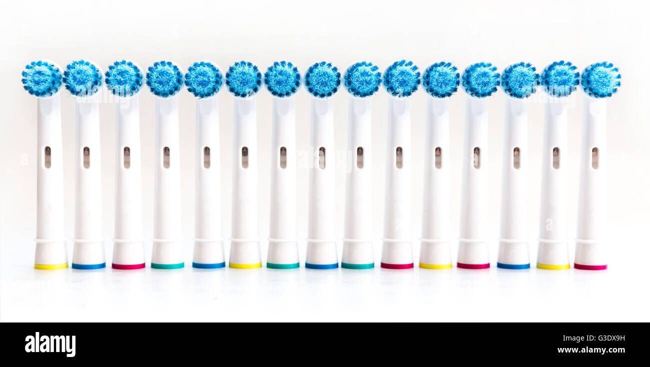 Electronic toothbrush heads in a row isolated on a white background ...