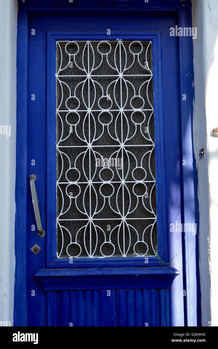 wrought iron patterns on a door of a house on the Greek island of ...