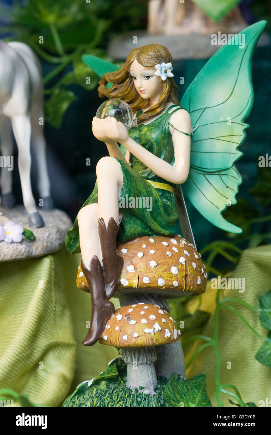 Display in a Shop window of a fairy sitting on top of toadstools Stock ...