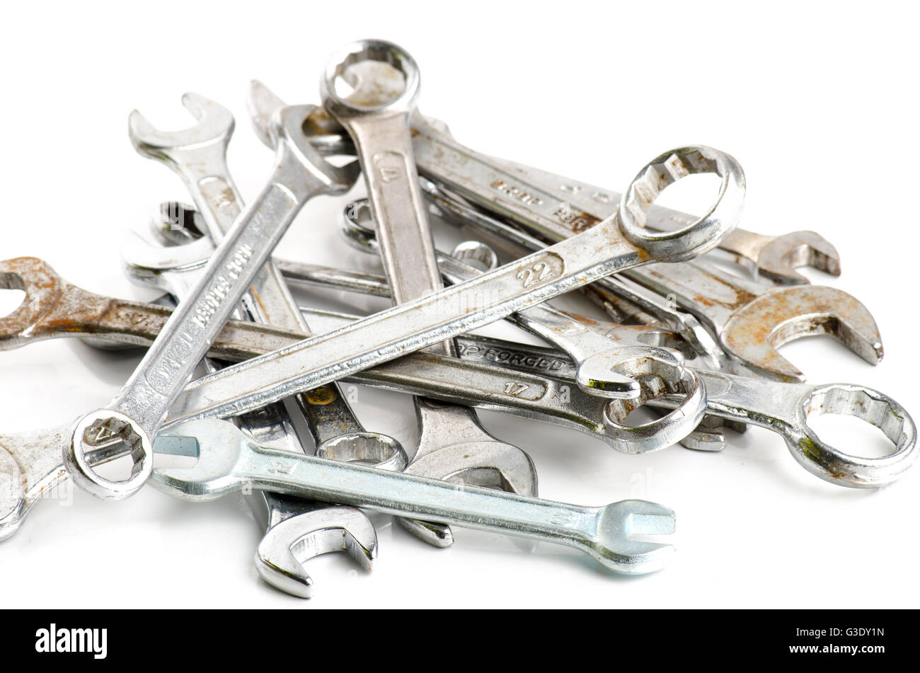 Many wrenches disordered, some of them rusted, isolated on white Stock ...
