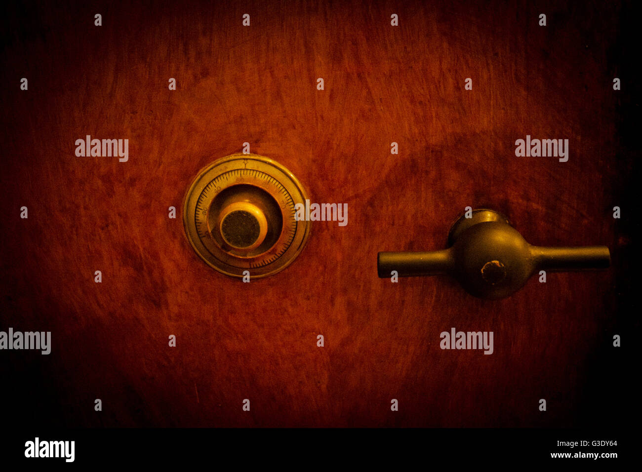 A closeup of an old rustic vintage safe with brass handle and ...