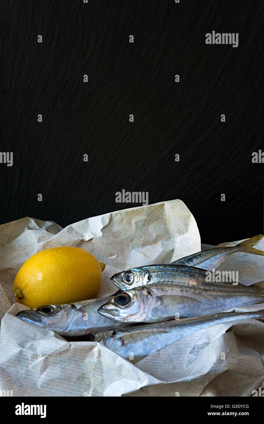 Raw fish wrapped in paper hi-res stock photography and images - Alamy