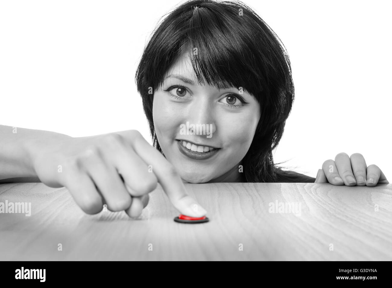 Studio shot of a thoughtful model holding her finger pushing a red ...