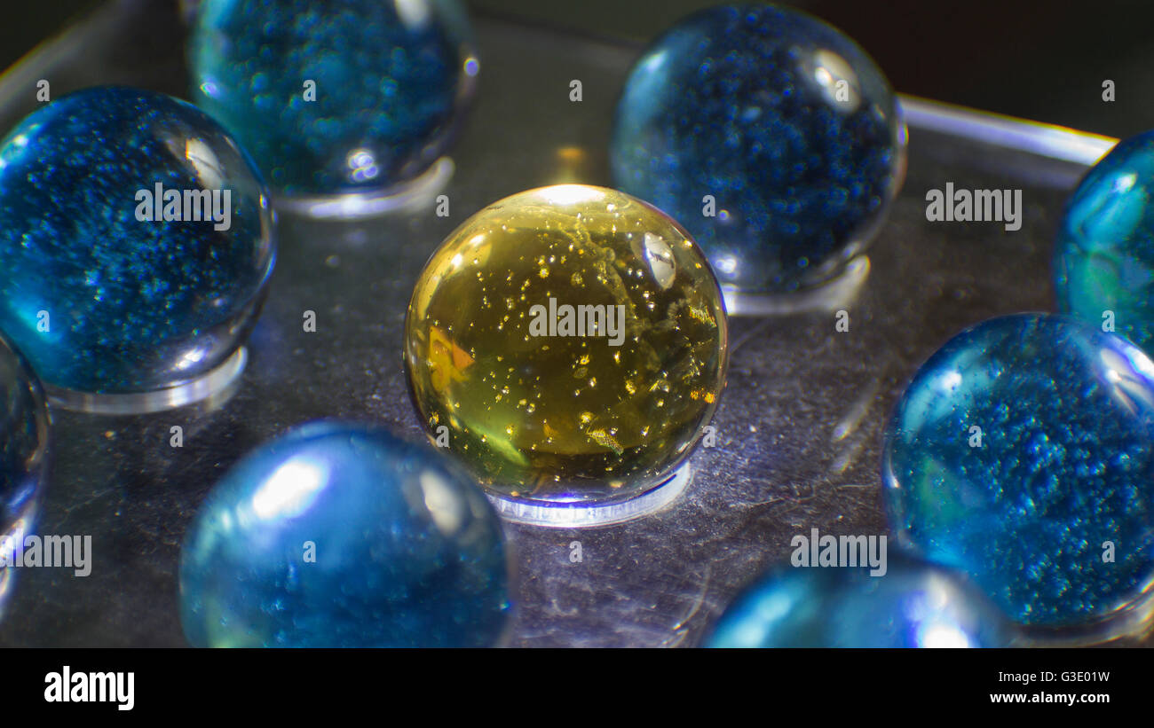 Illuminated clear marbles on a base Stock Photo - Alamy