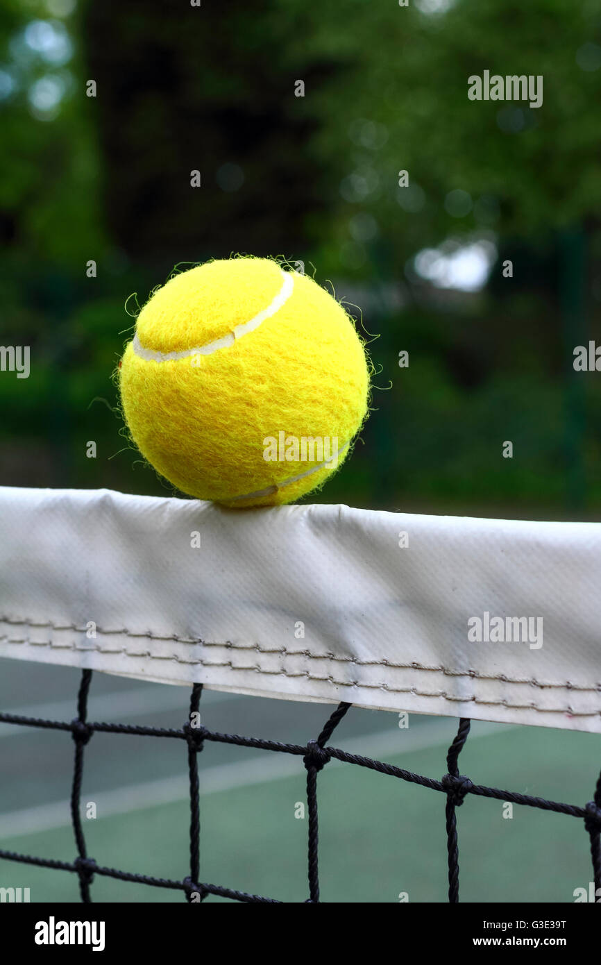 Tennis ball hitting a tennis net Stock Photo - Alamy