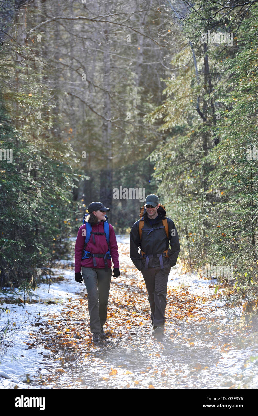 Backpacking couple walks the Albert Loop Trail in Chugach State Park near the Eagle River Nature ...