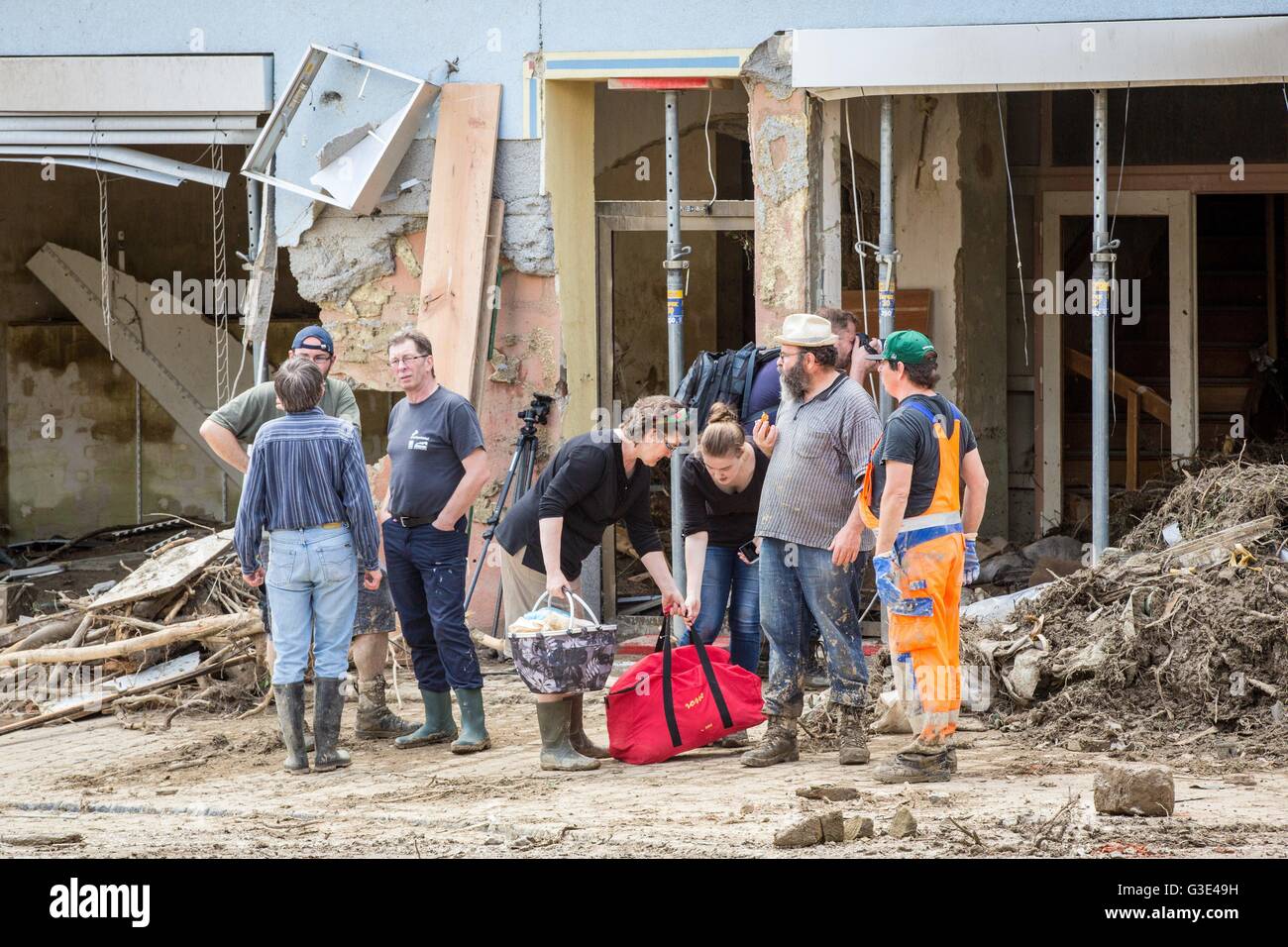 Flooding catastrophy, heavy devastation, civil volunteers helping ...