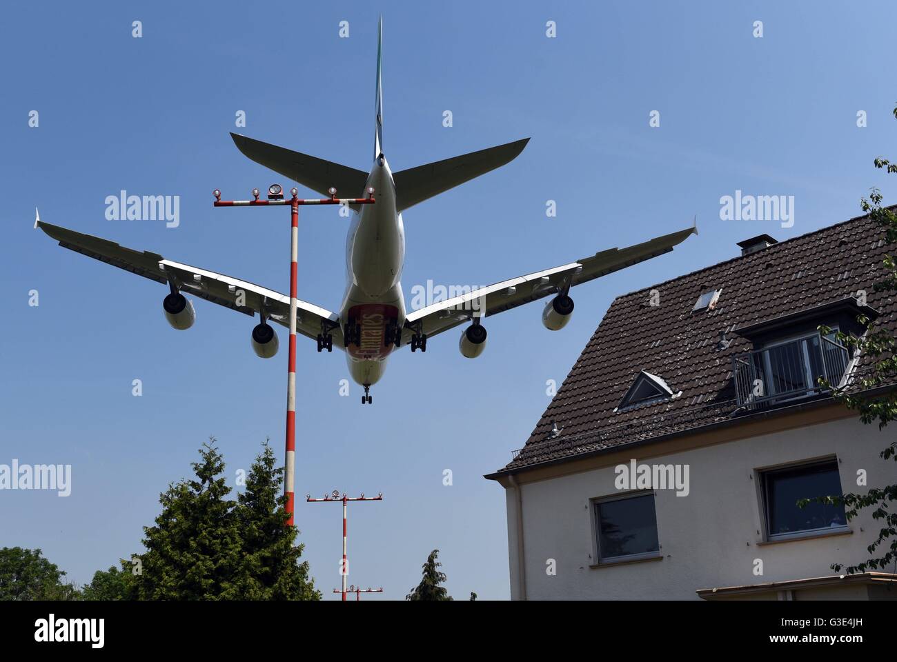 An Airbus A380 by Emirates Airlines very close to the roof of an ...