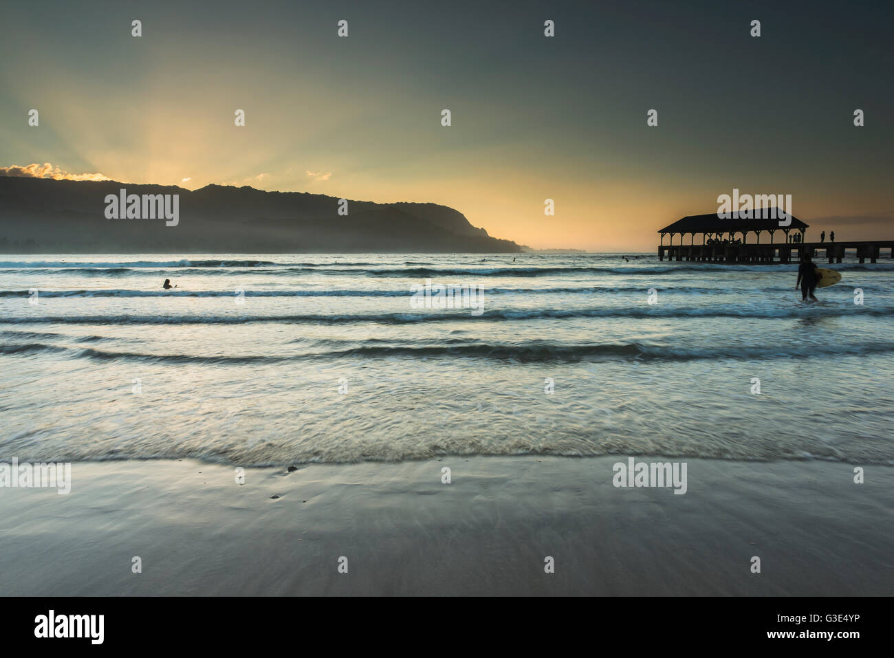 Evening sun over Hanalei Bay and pier; Kauai, Hawaii, United States of ...