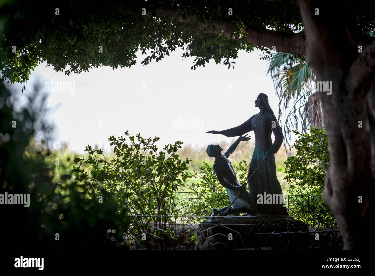 On the Sea of Galilee, a statue beside the Church of St Peter's Primacy ...