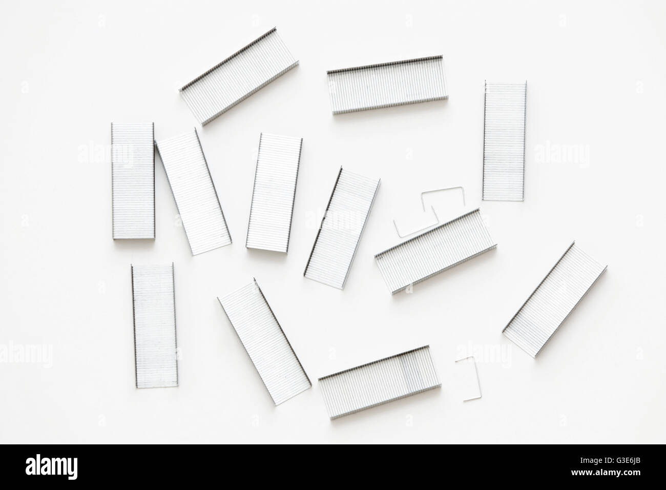A top view of a group of staples on white background Stock Photo - Alamy
