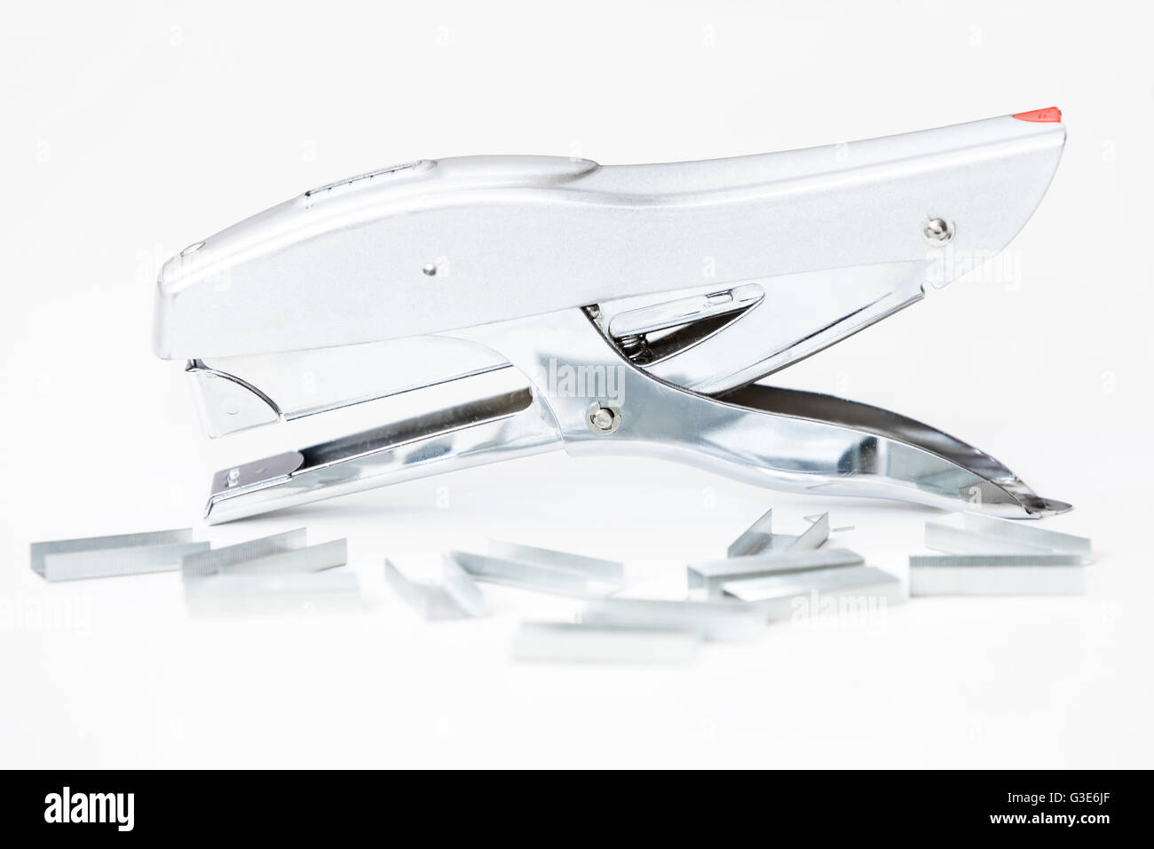 A staple and a group of staples arranged on white background Stock ...