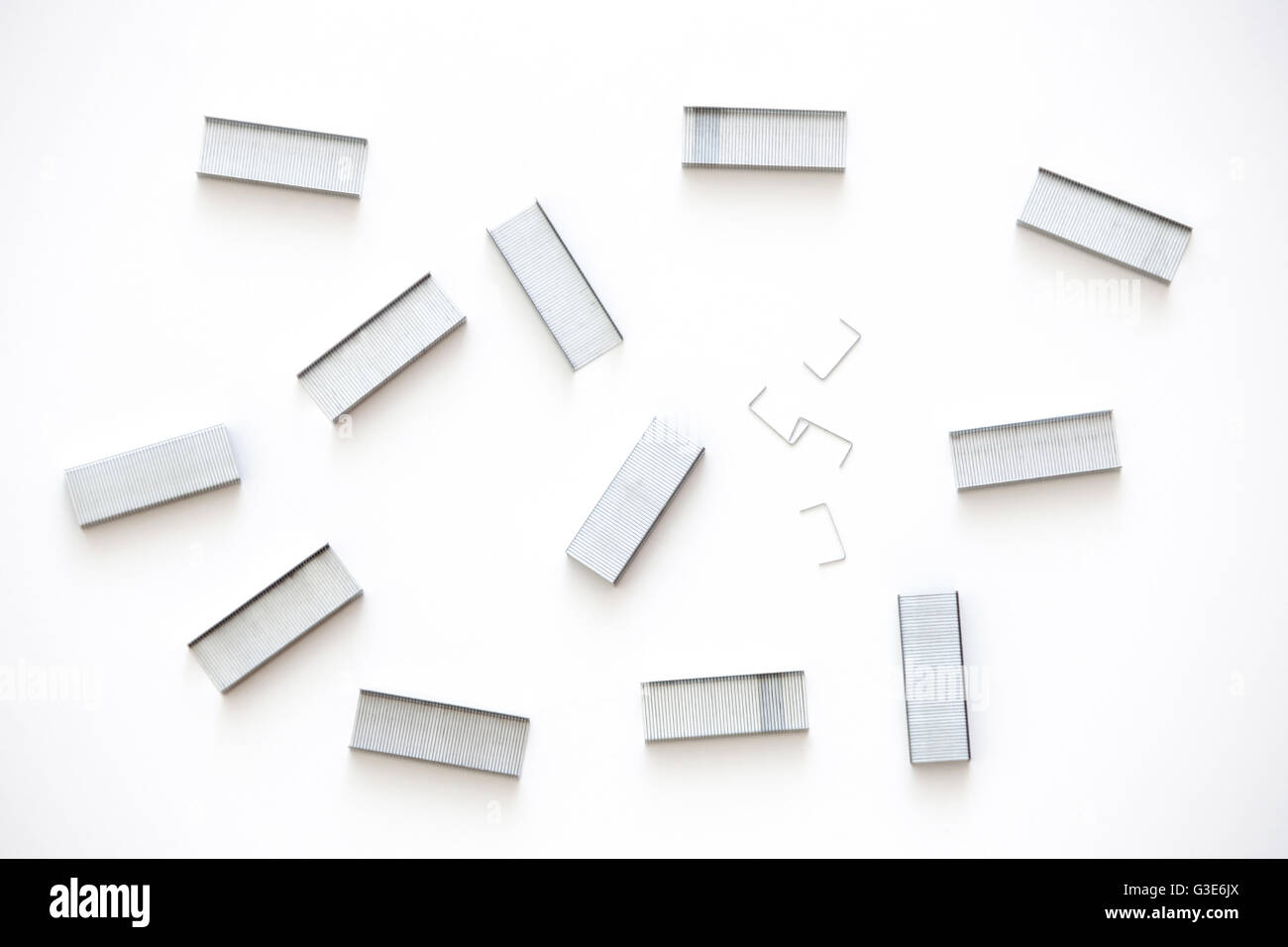 A top view of a group of staples on white background Stock Photo - Alamy