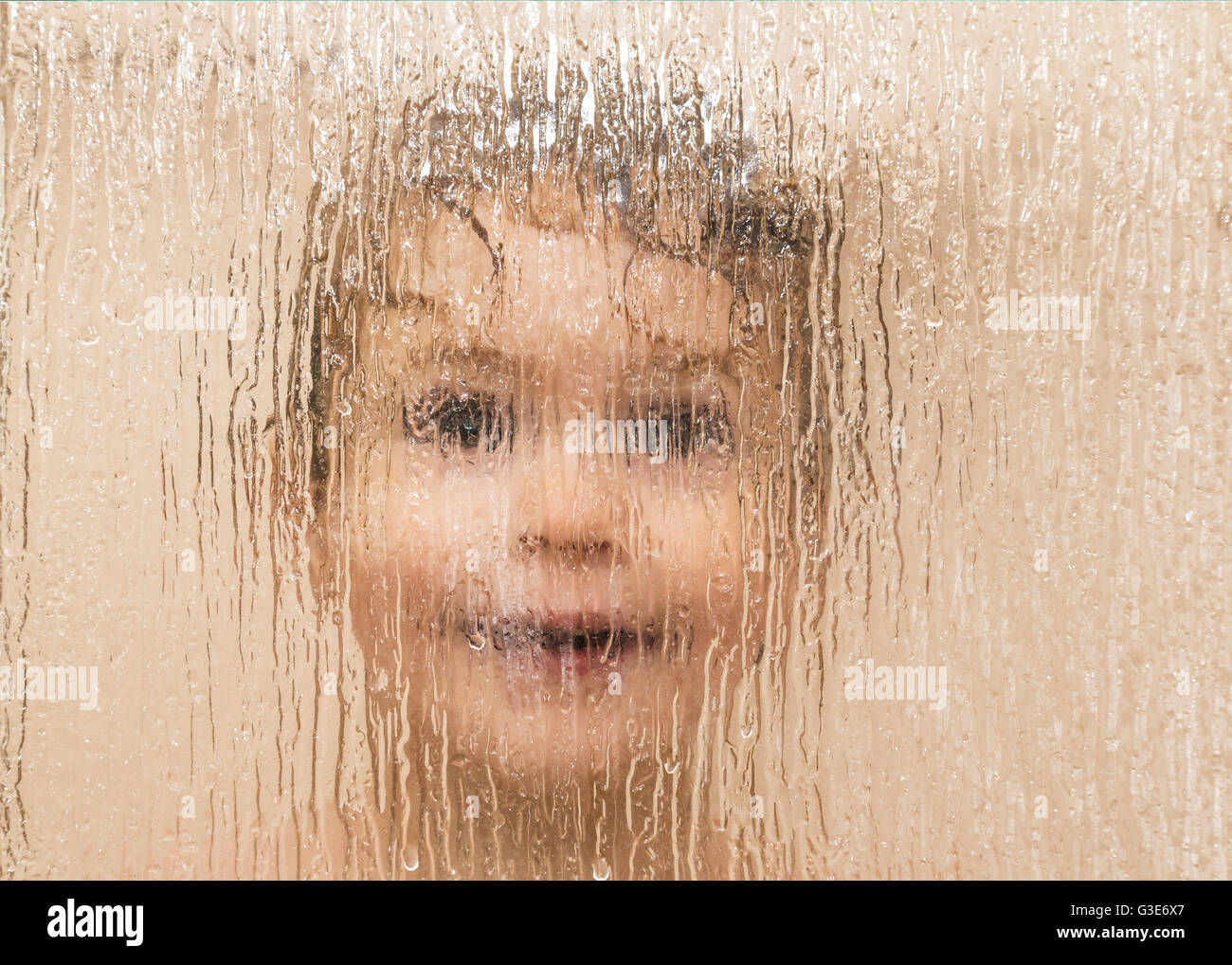 Child peering through door hi-res stock photography and images - Alamy