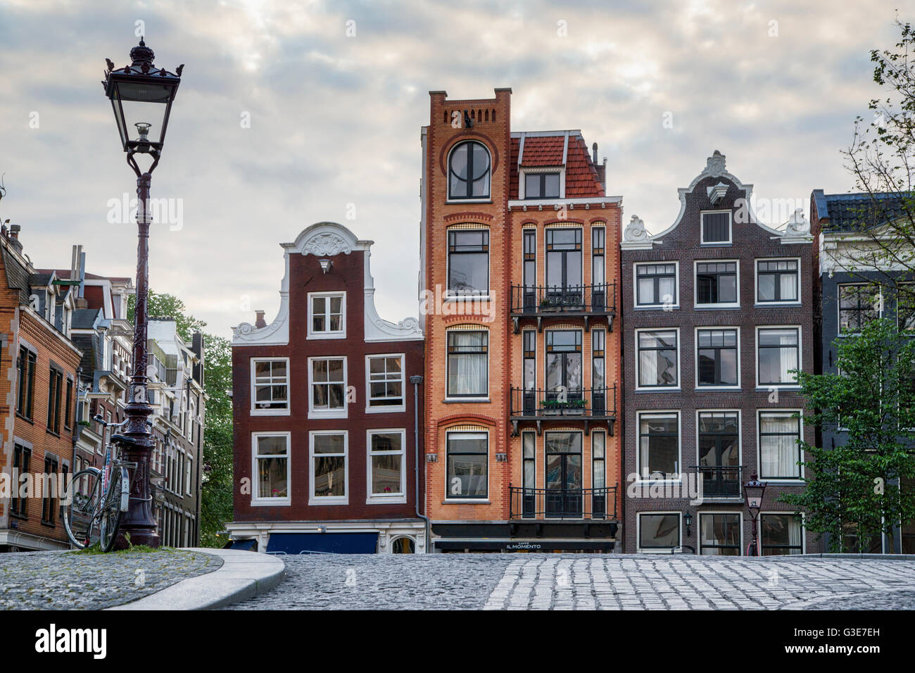 Unique residential buildings and a lamp post; Amsterdam, Netherlands ...