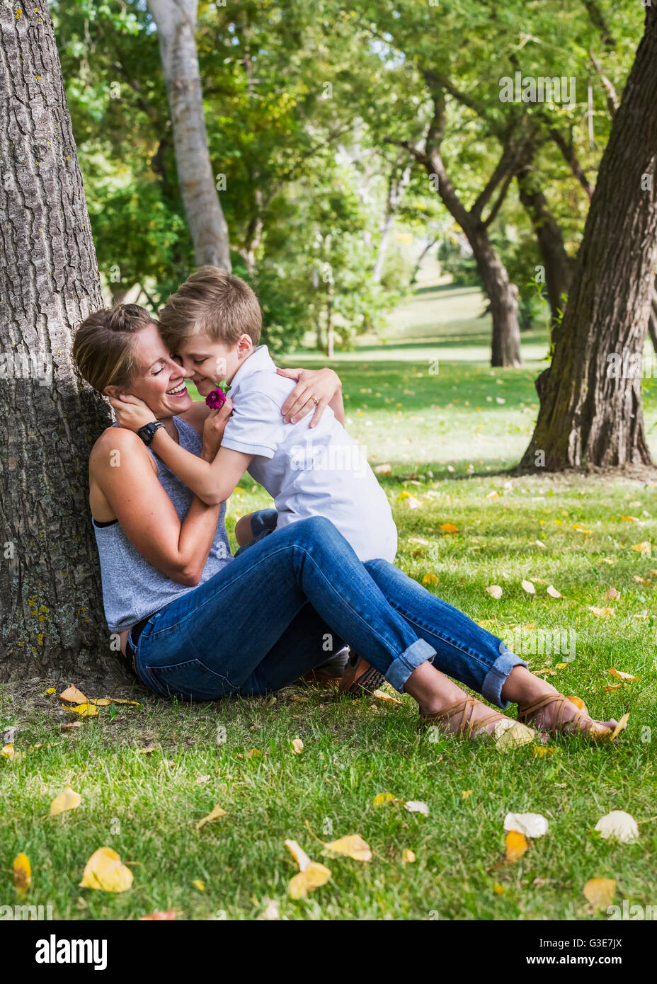 Mother getting a flower from her son while spending quality time at a ...