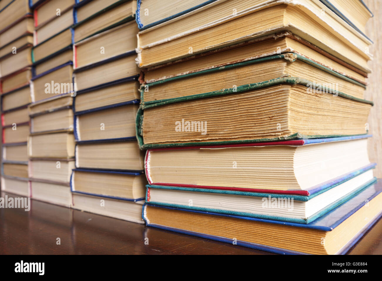 Many old books in a book shop or library, education and reading concept ...