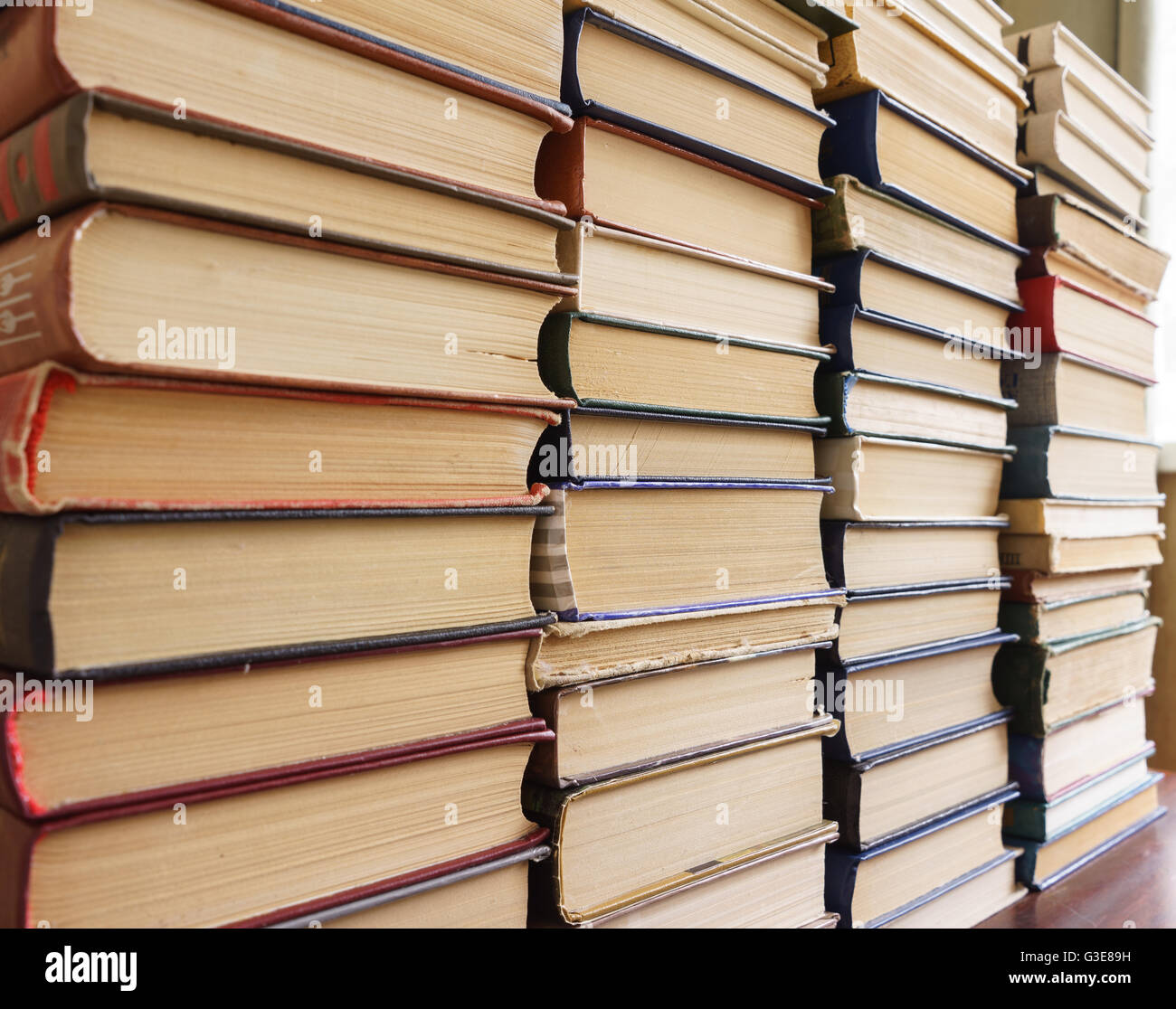 Many old books in a book shop or library, education and reading concept ...