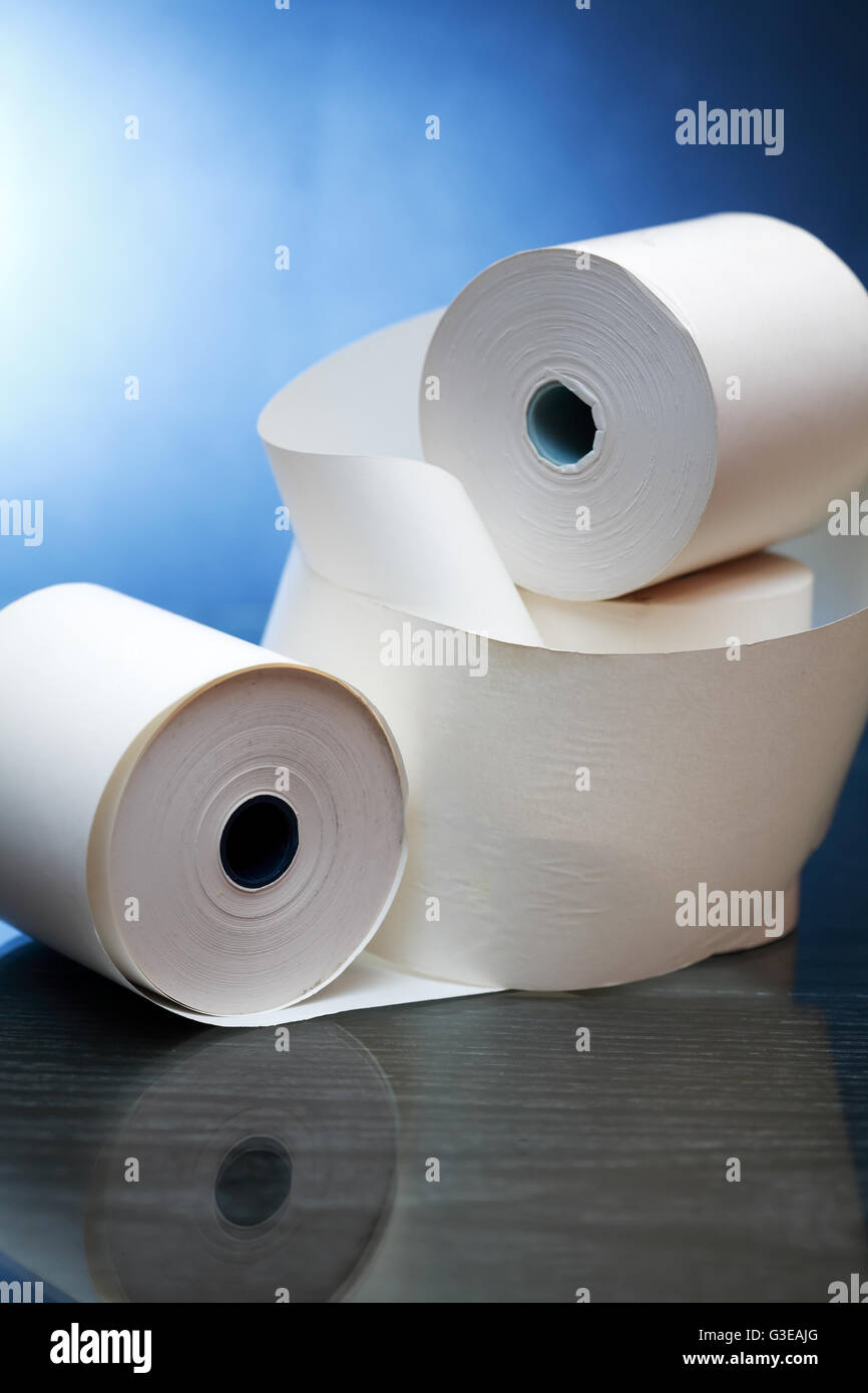 White paper rolls with reflection on dark background Stock Photo - Alamy