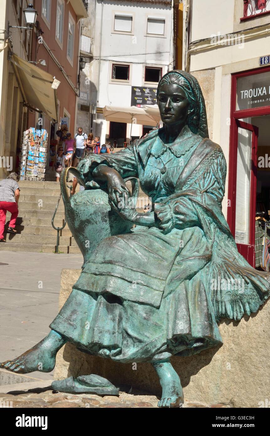 Bronze statue of Portuguese woman in the historical center of Coimbra ...