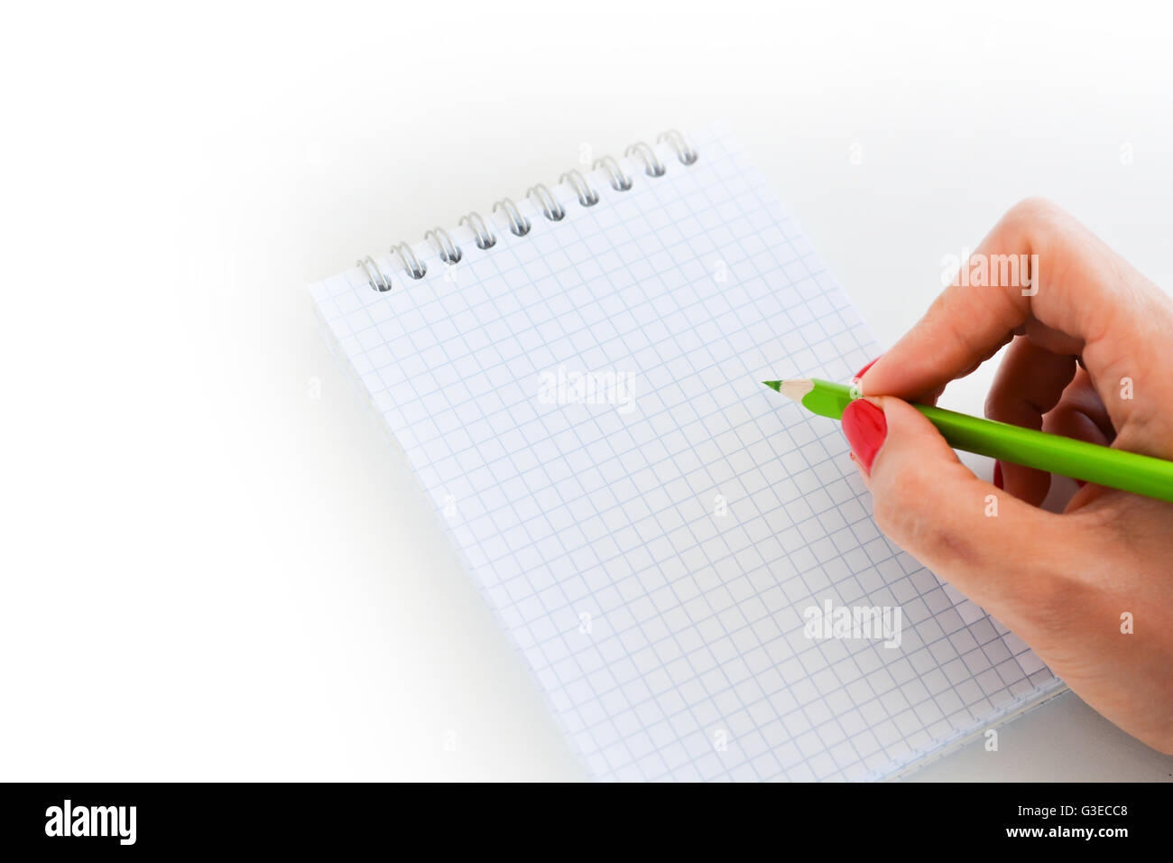 Pencil and a math notebook on white background Stock Photo - Alamy