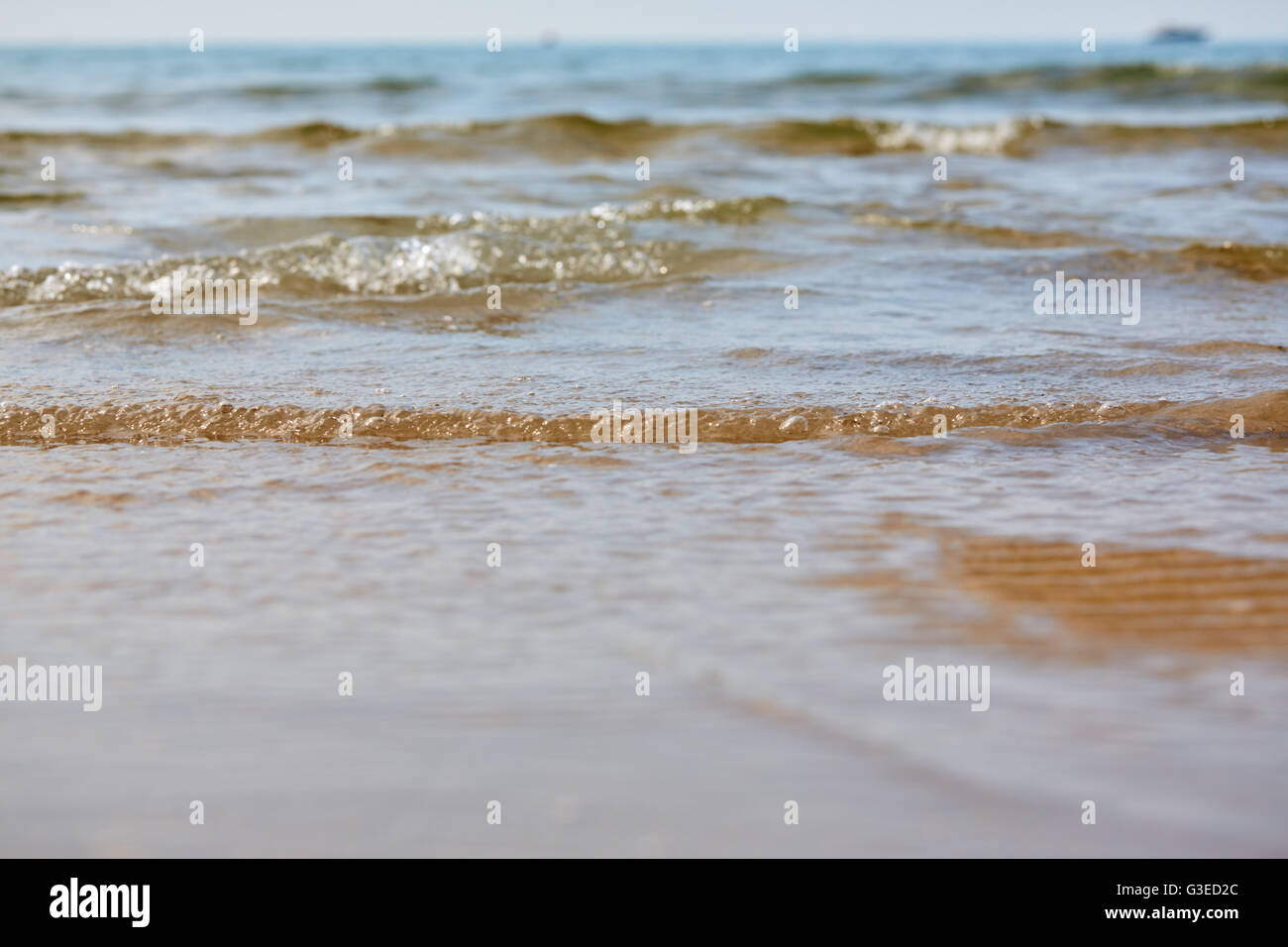 Little ripples in the sand from the sea on the beach Stock Photo - Alamy