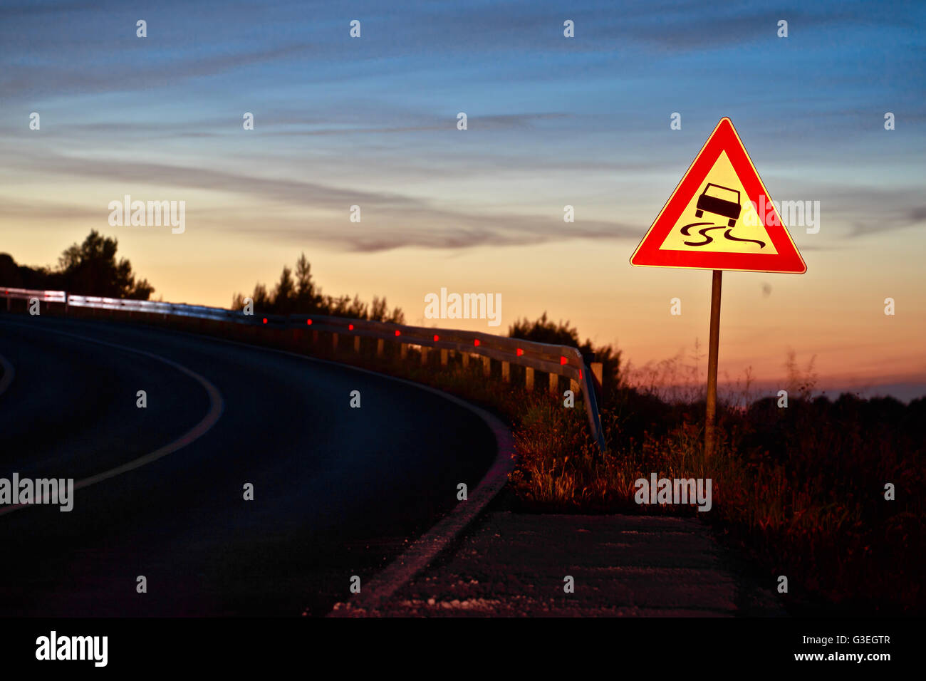 Dangerous curve road warning sign hi-res stock photography and images ...
