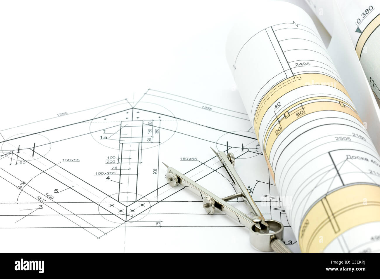 architectural blueprint rolls with plan and drawing compass Stock Photo ...