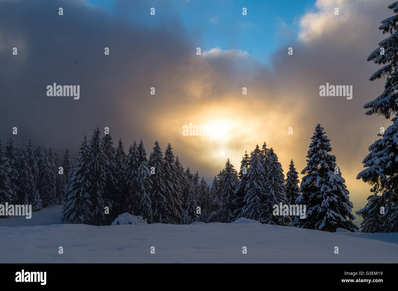 Winter scene with sunset in mountains Stock Photo - Alamy