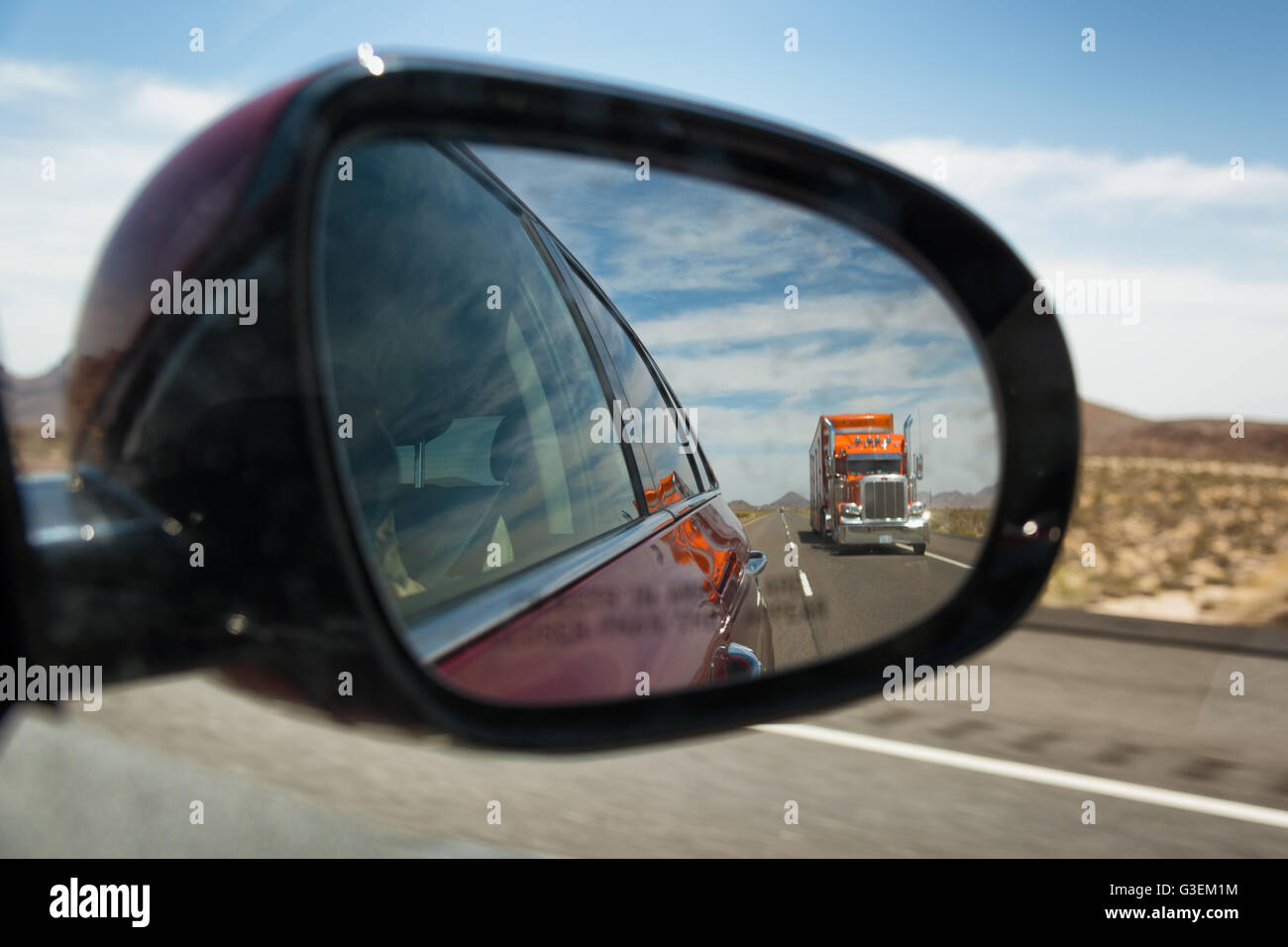 truck reflection in the rearview mirror of a car on the highway Stock ...