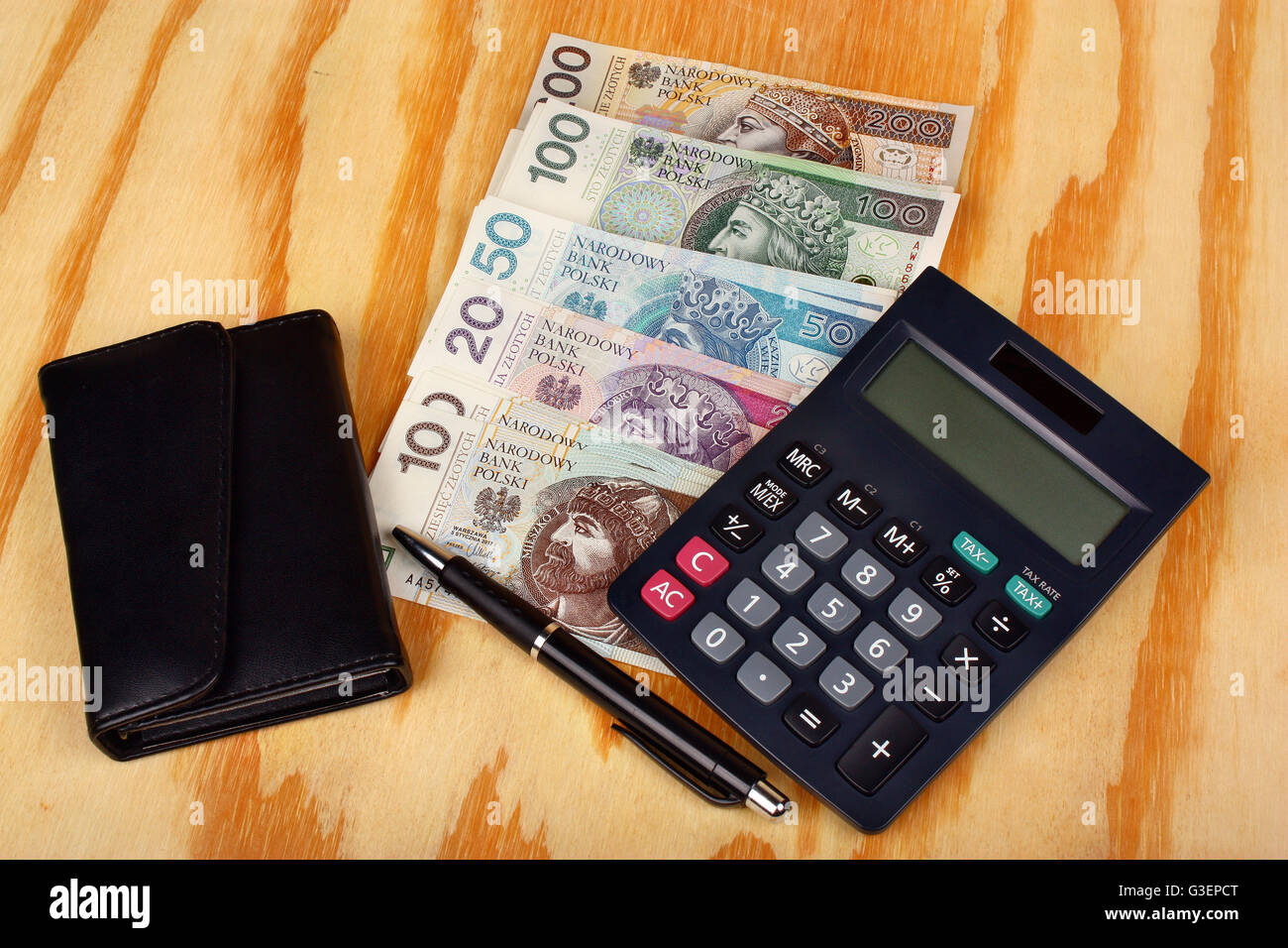 Polish money calculator pen on the table Stock Photo - Alamy