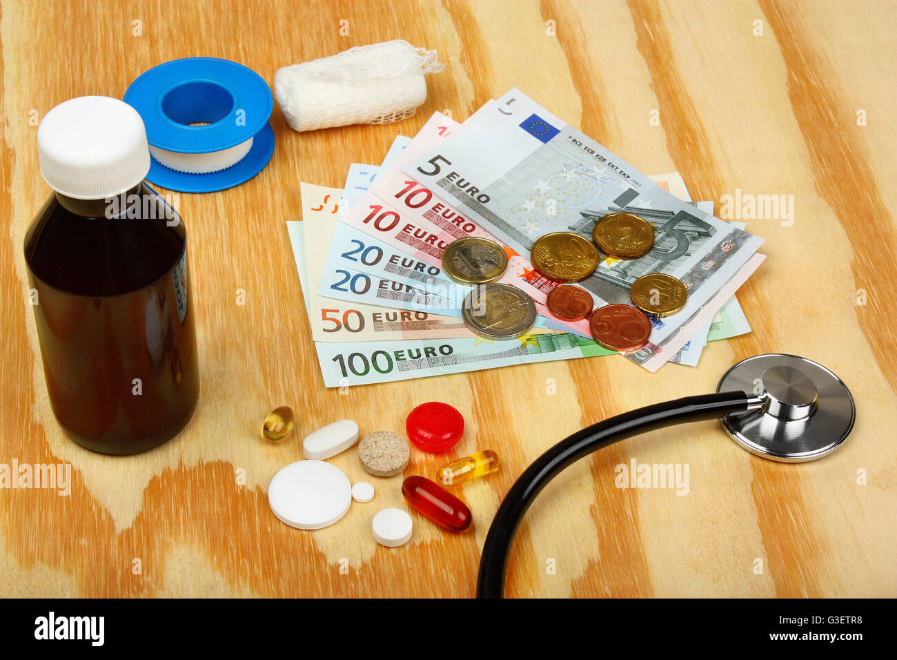 Pills, syrup, bandage and stethoscope on wooden background Stock Photo ...