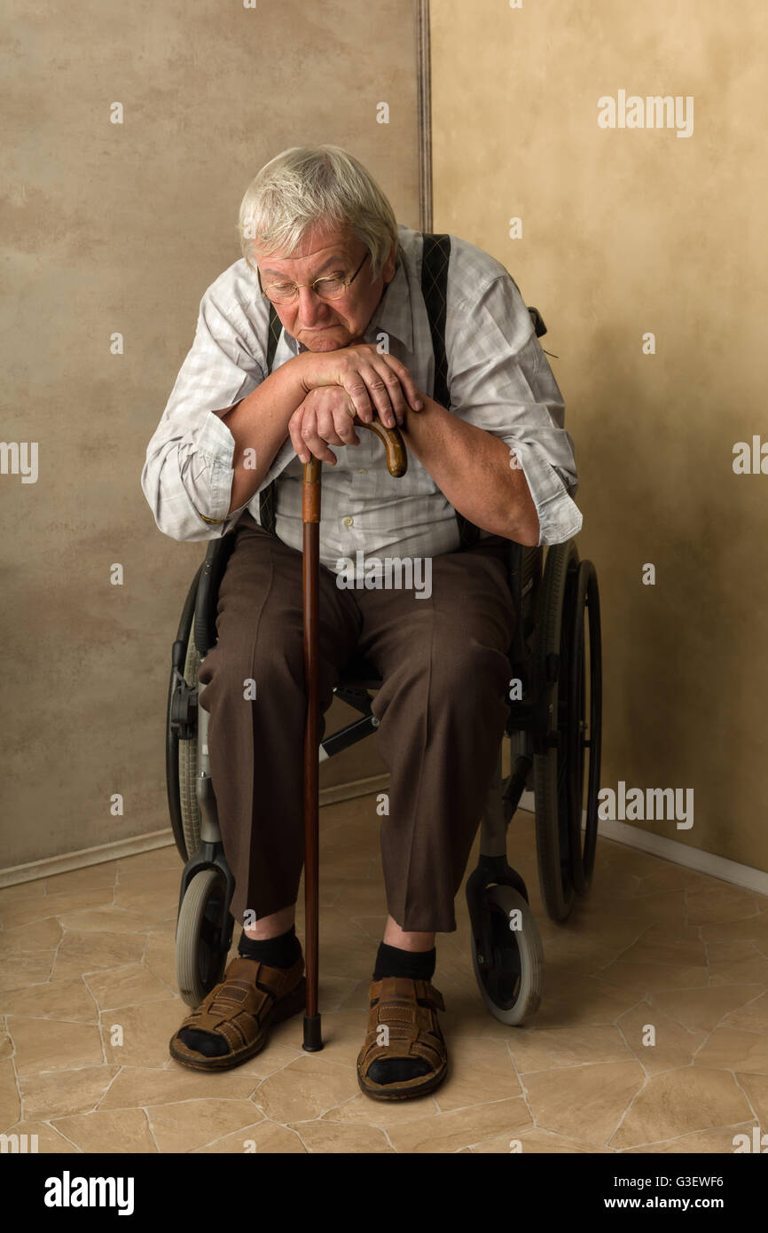 Lonely old man in nursing home leaning on his cane Stock Photo - Alamy