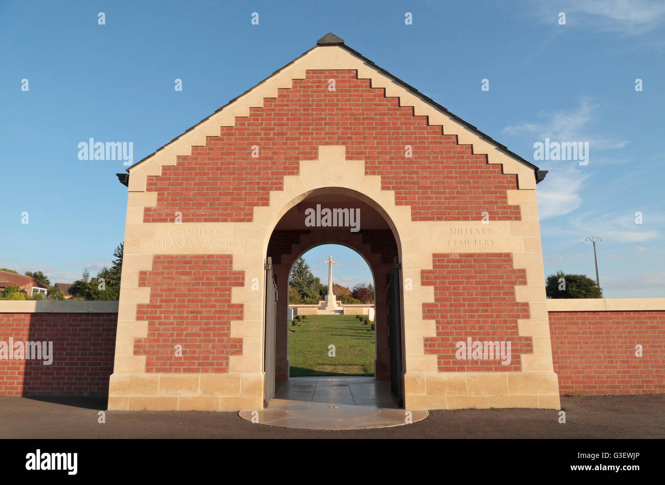 Cross of Sacrifice seen through the arch entrance to the CWGC Fromelles ...