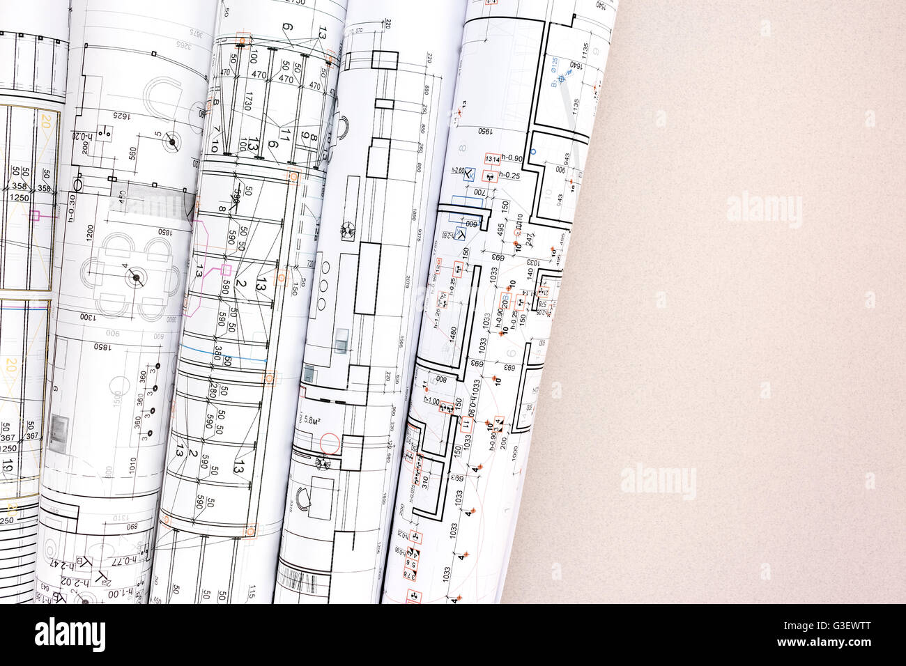 rolls of architecture blueprints and house plans on the table Stock ...
