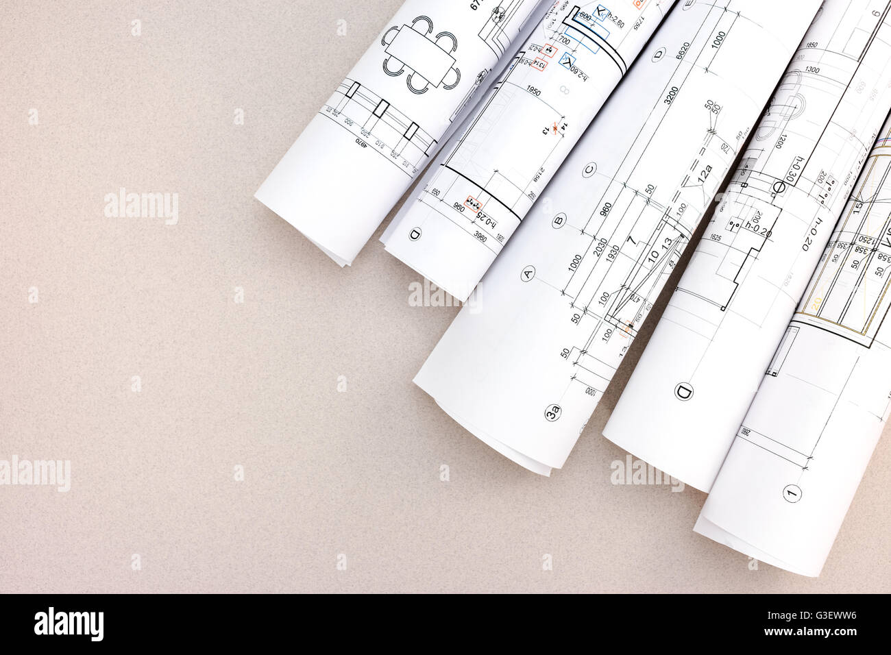 architectural background with rolls of technical drawings Stock Photo ...