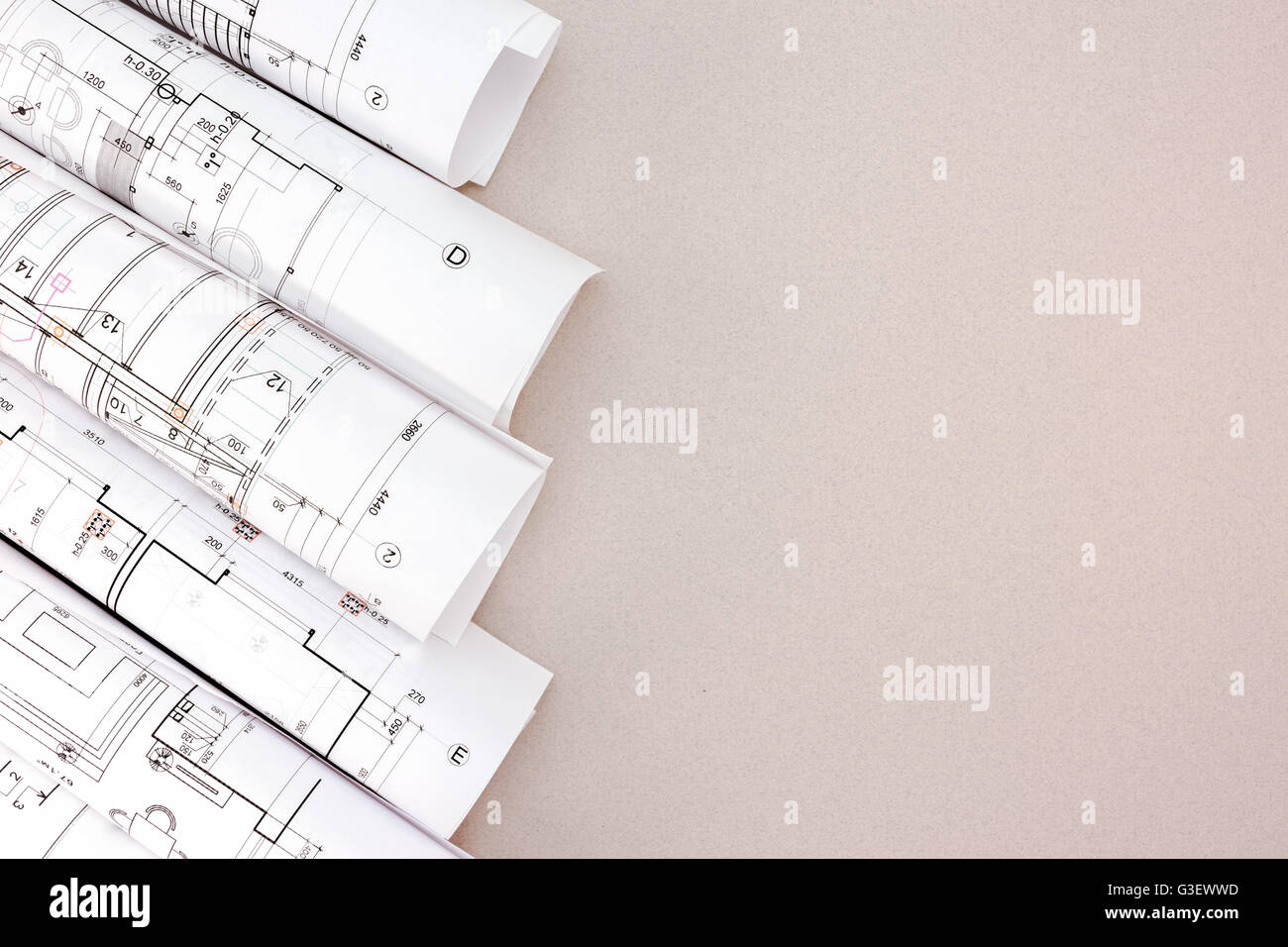 architect workspace with rolls of blueprints and house plans top view ...