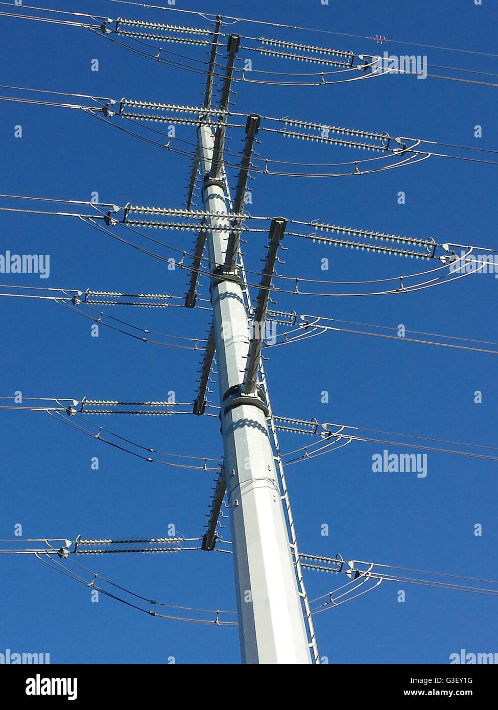 Modern electric tower on blue sky Stock Photo - Alamy