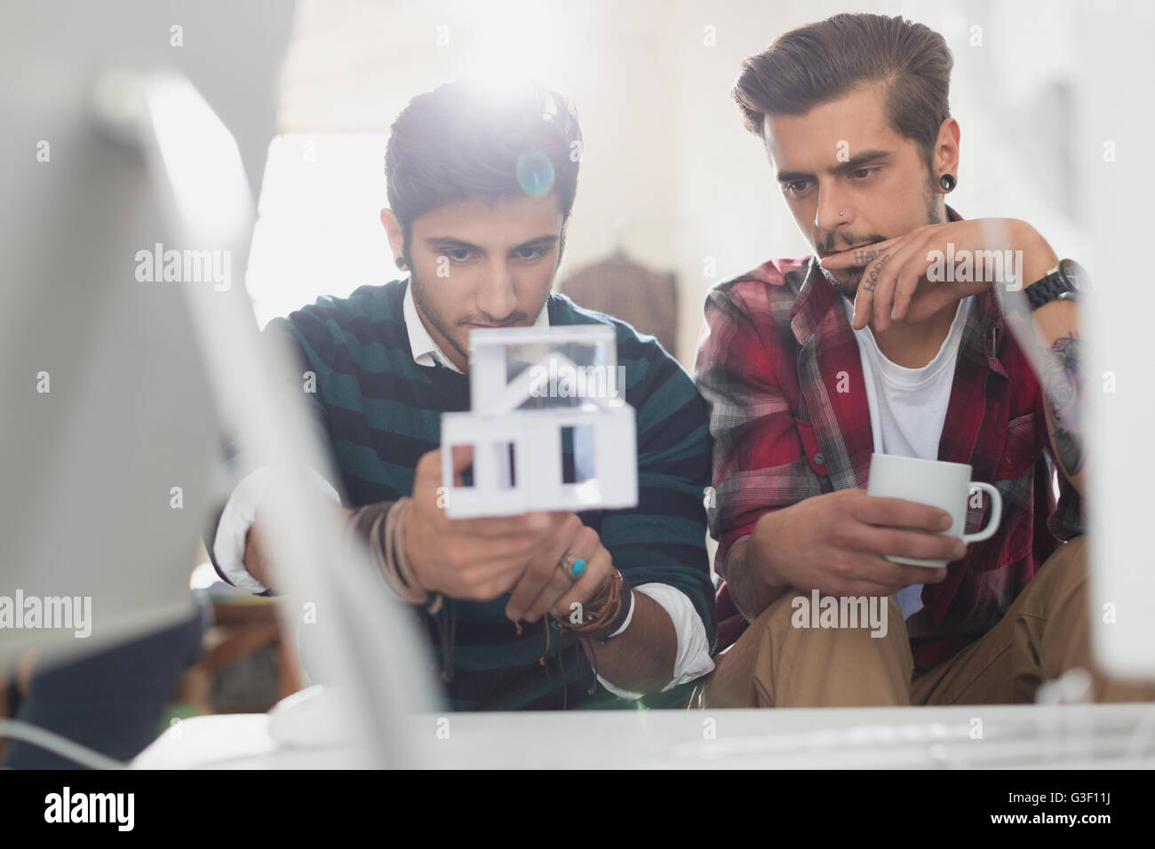 Group young architects model house hi-res stock photography and images ...