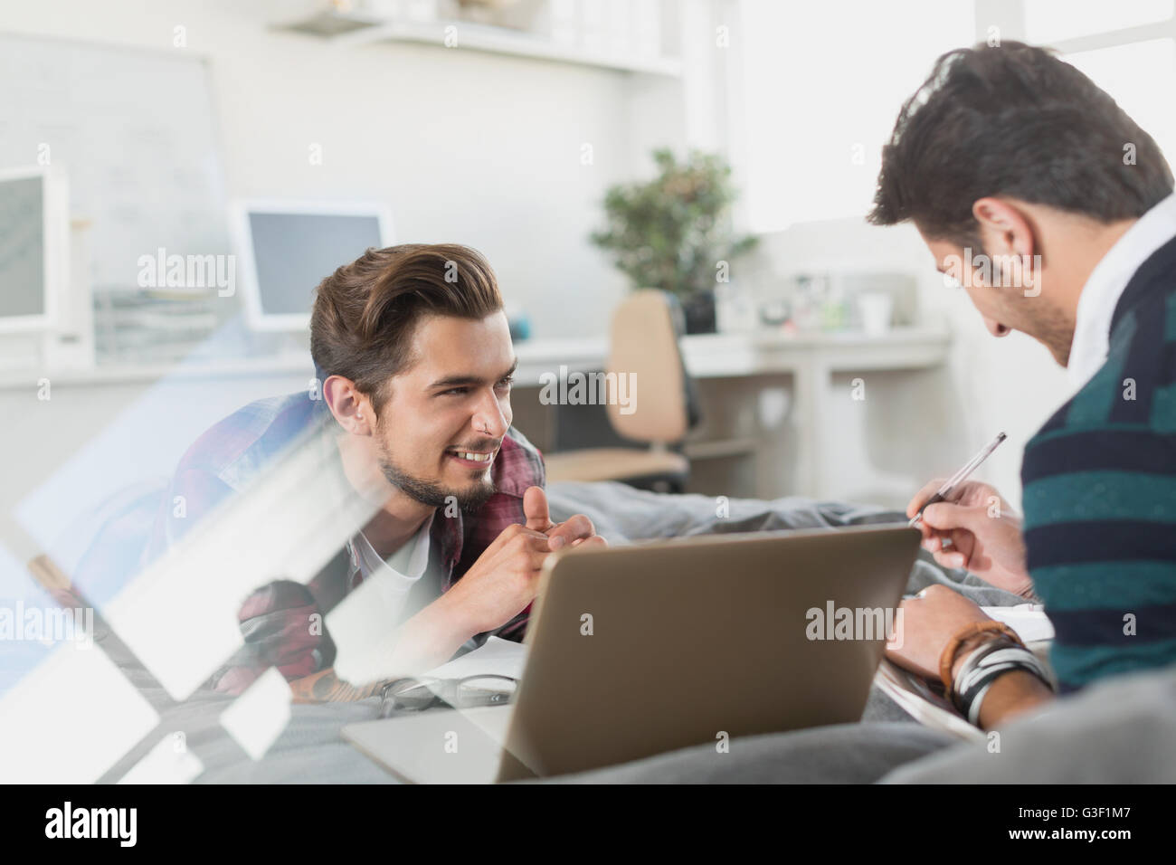 Male college students studying with laptop Stock Photo - Alamy