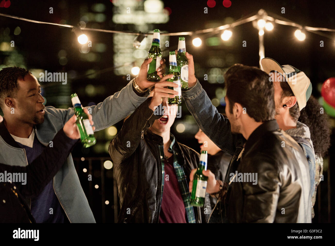 Toasting with bottles hi-res stock photography and images - Alamy