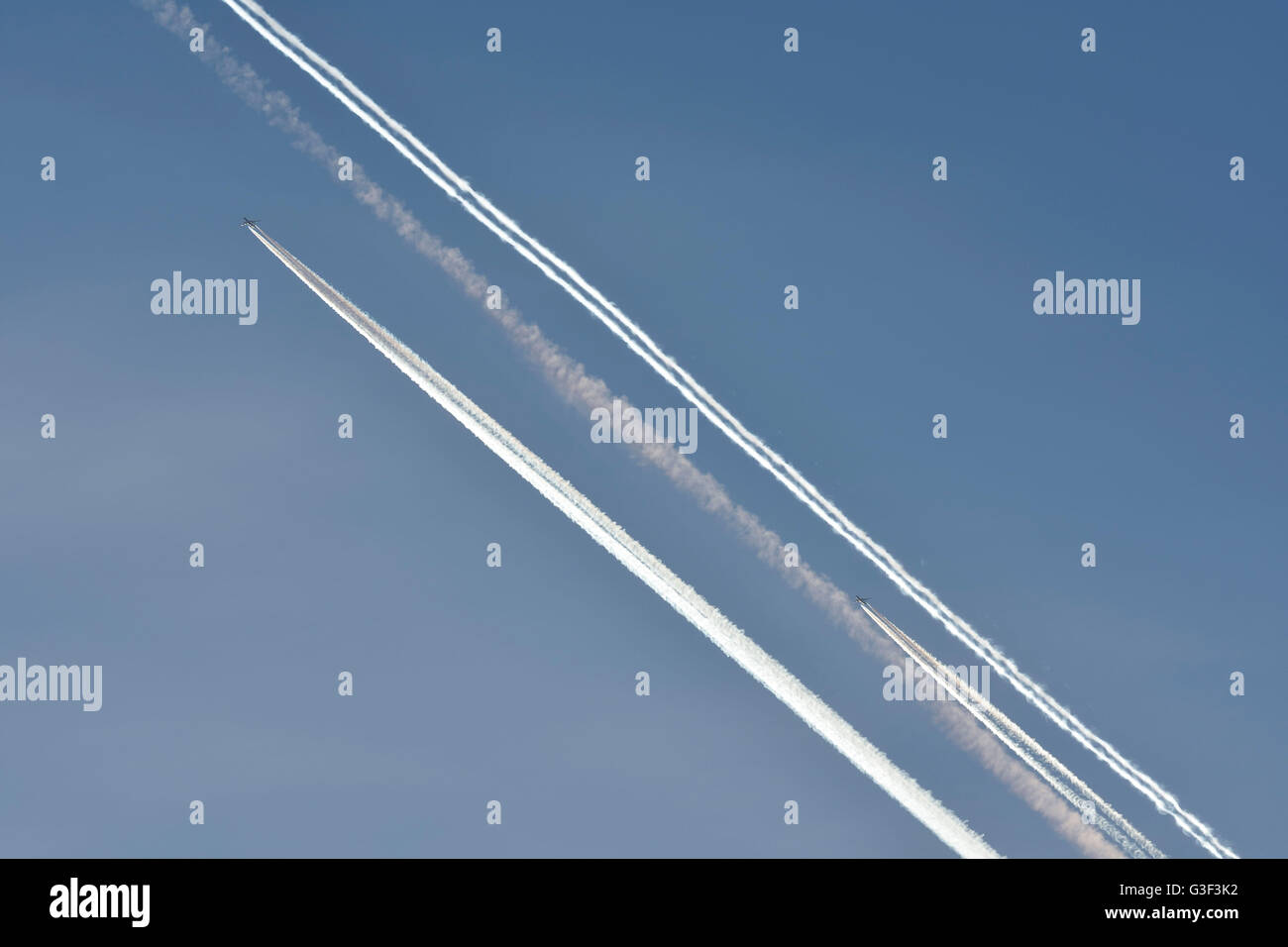 Two Planes with Contrails in the Sky, Hesse, Germany Stock Photo - Alamy