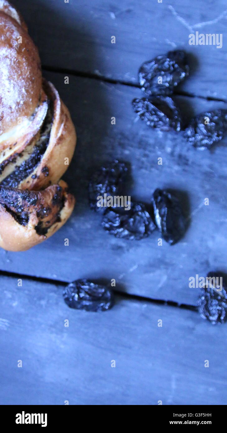 Delicious breakfast prunes on a dark wooden table Stock Photo - Alamy