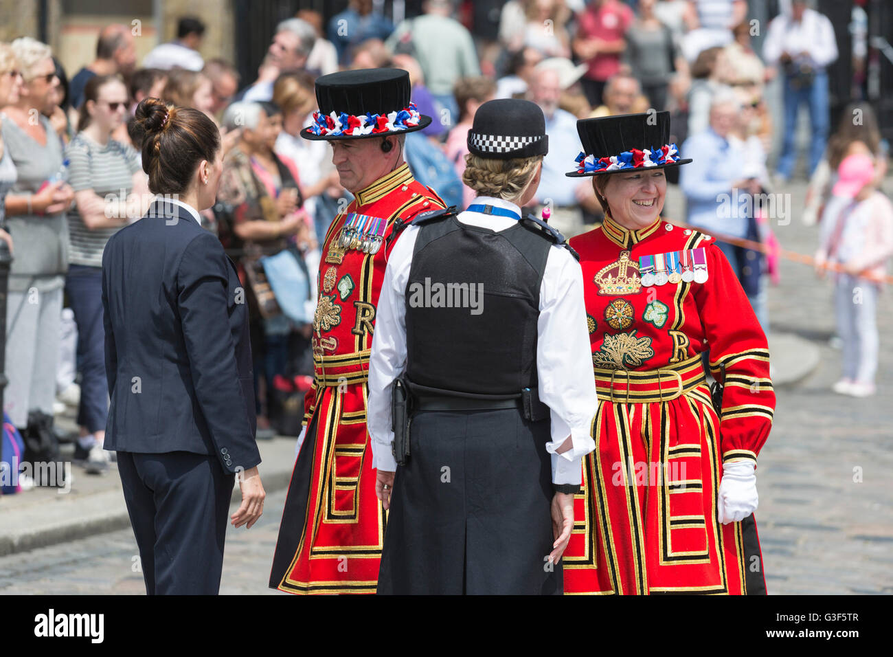 Male and female Yeoman Warders and a female Police Officer at the Tower ...