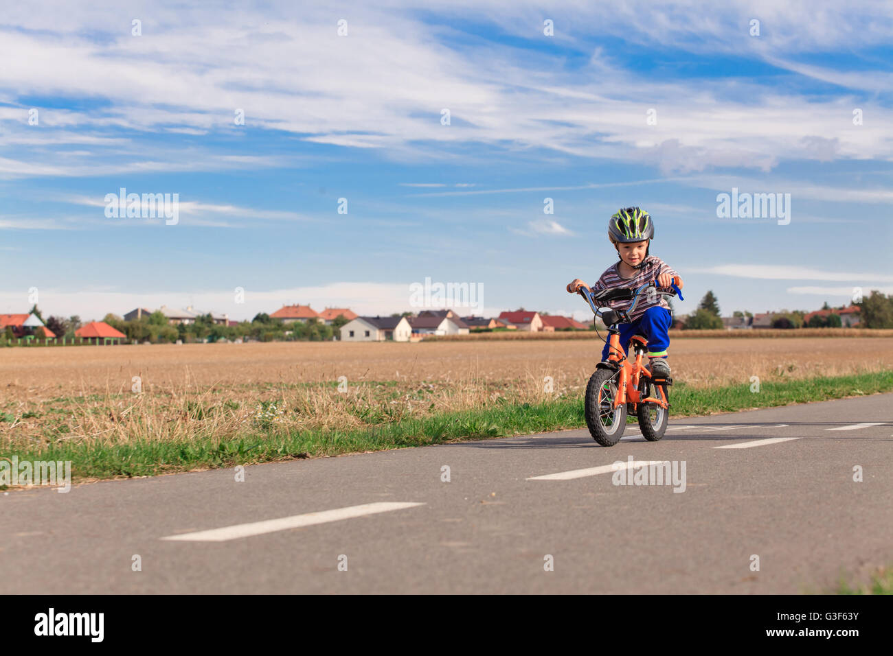 Little boy on a bicycle for the first time Stock Photo - Alamy