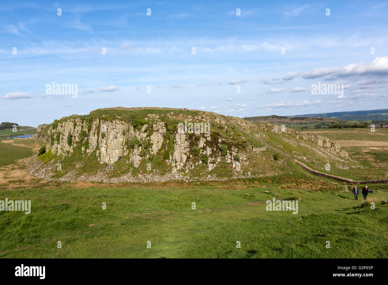 Couple walking along Steel Rigg, Hadrian's Wall near Crag Lough ...